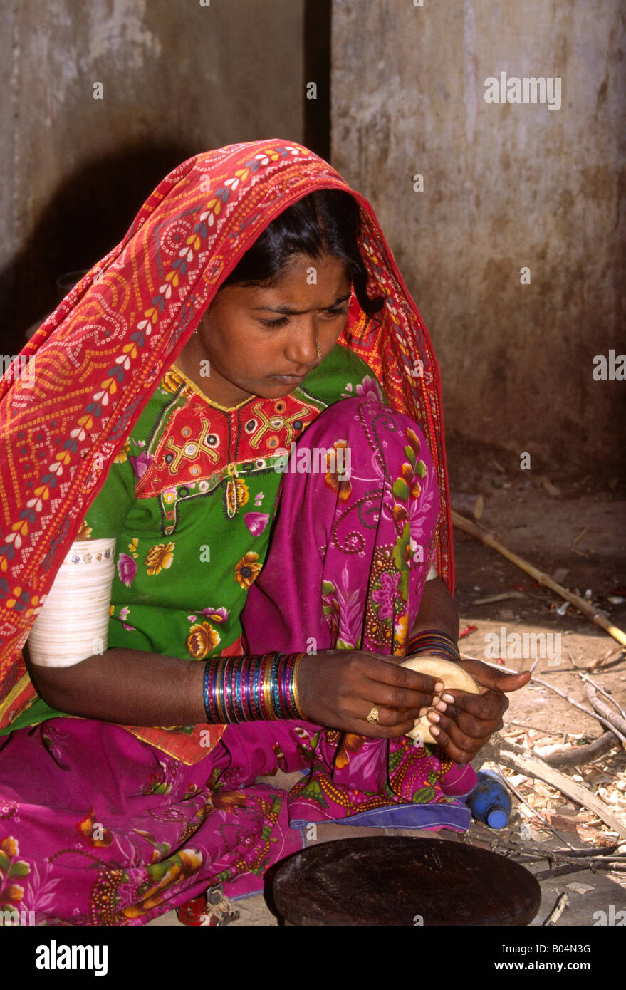 India Rann of Kutch Gujerat Nirona village young girl making chapati ...