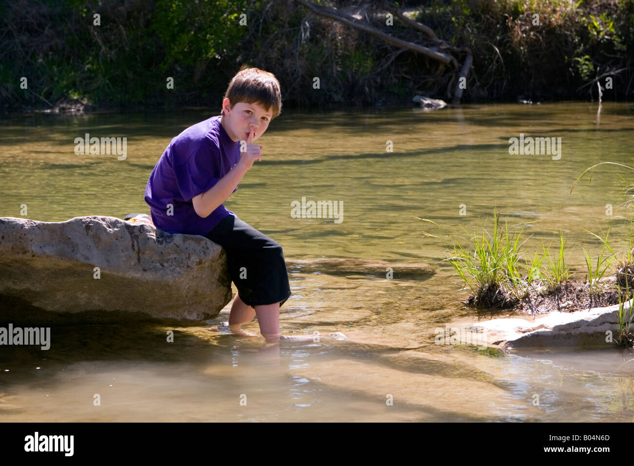 Young boy surrounded by natural Texan landscape Stock Photo - Alamy