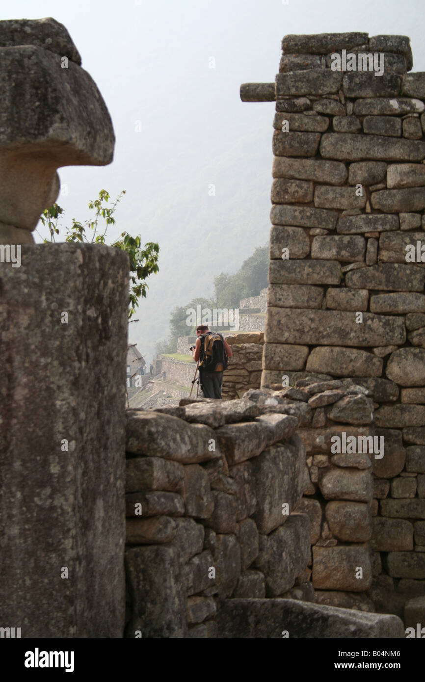 Tour guide filming at Machu Picchu Peru Stock Photo - Alamy