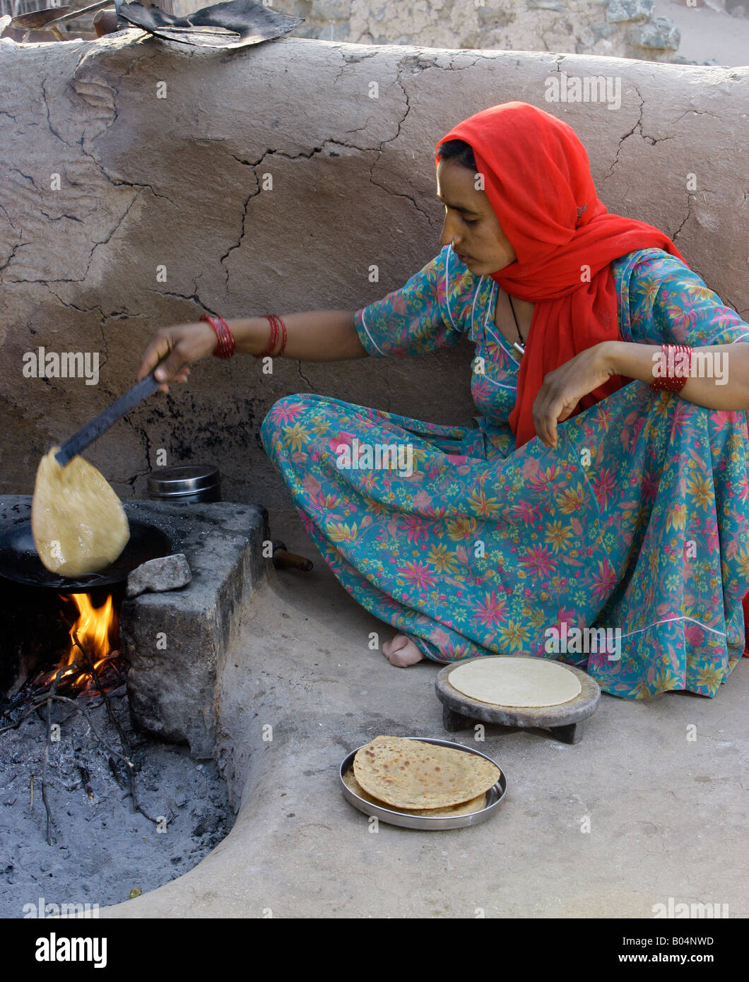 Woman Cooking Over Open Fire High Resolution Stock Photography and ...