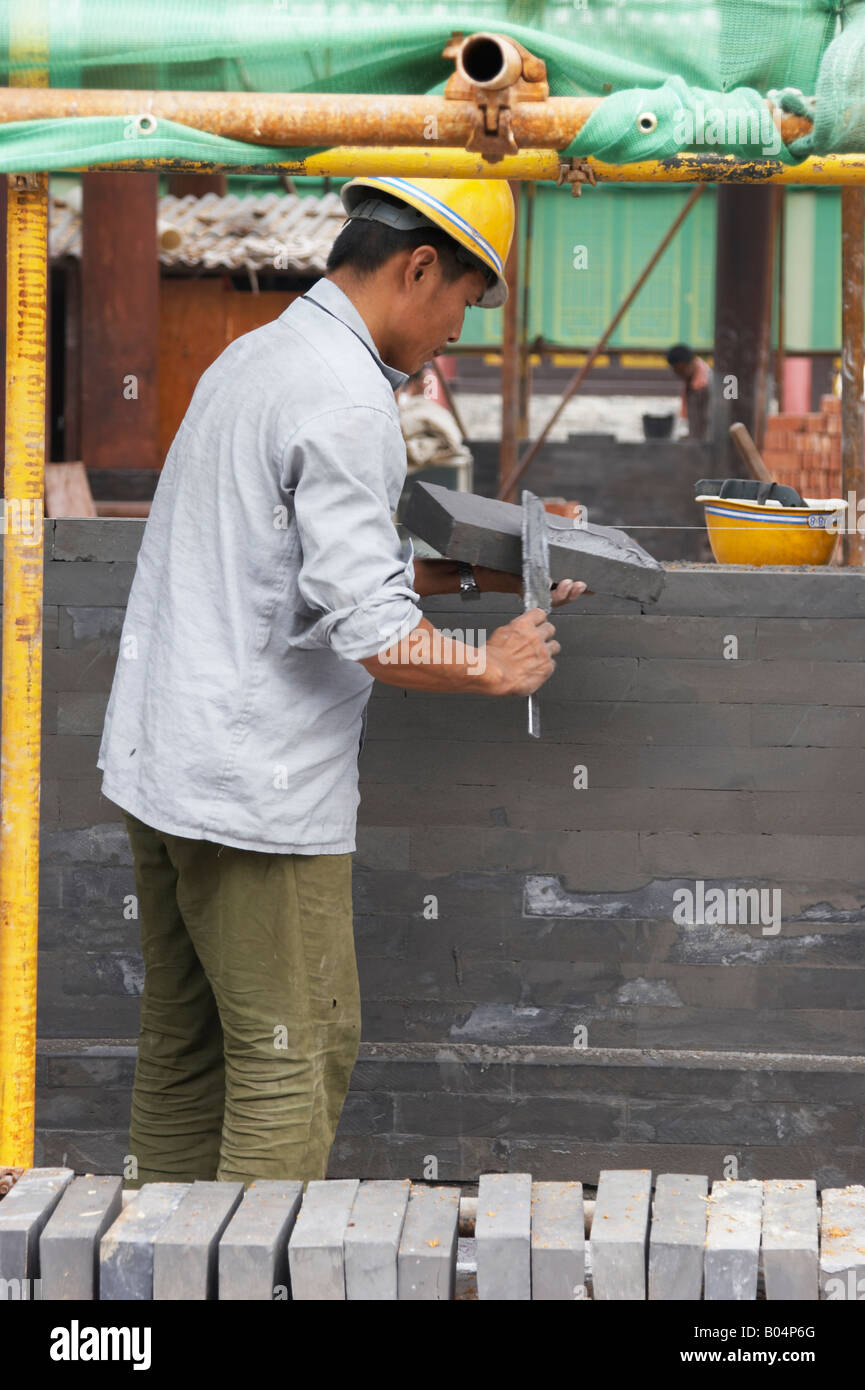 Man Building Wall On Construction Site, Xian, China Stock Photo - Alamy