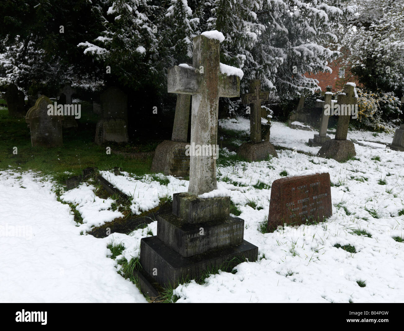 Graveyard in the Winter Falling Snow Stock Photo - Alamy