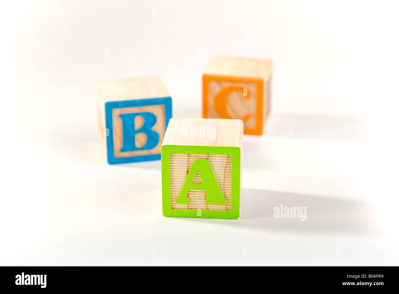 ABC blocks laying on white surface Stock Photo - Alamy