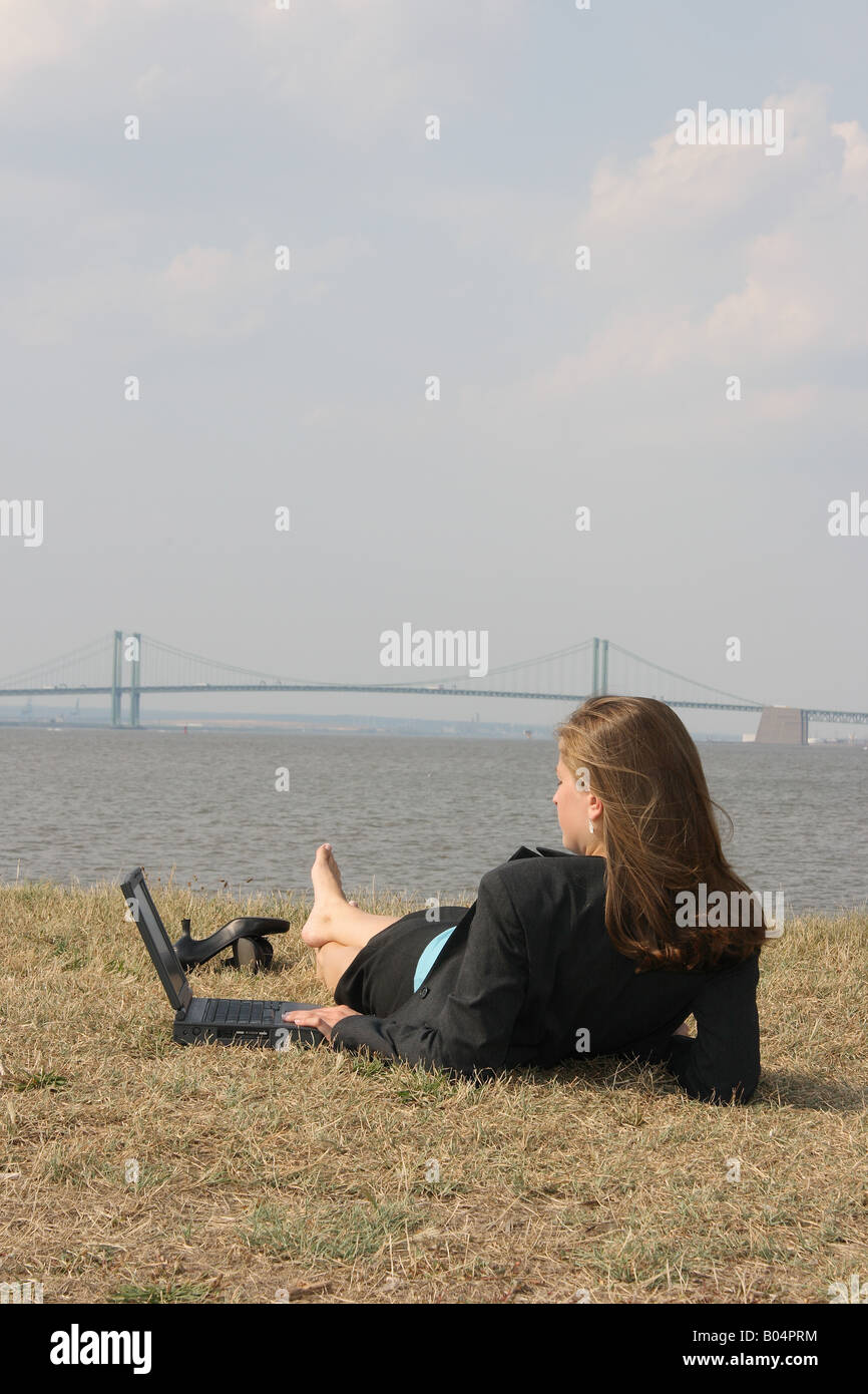 business woman at work by the river Stock Photo - Alamy