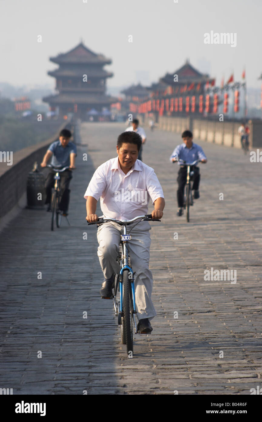 Chinese Tourists Cycling Along On City Wall, Xian, China Stock Photo ...