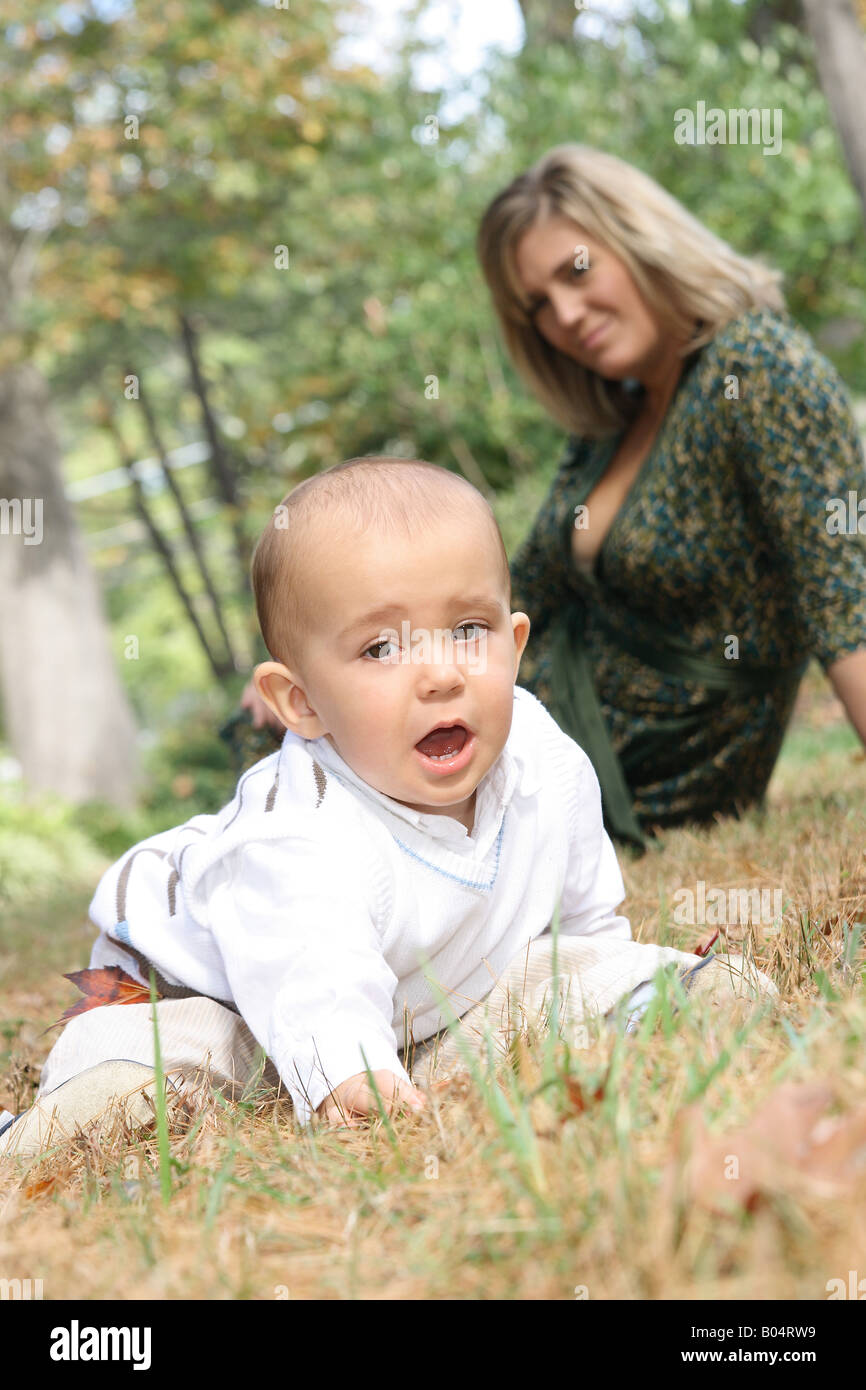 mom keeps an eye on the baby exploring Stock Photo - Alamy
