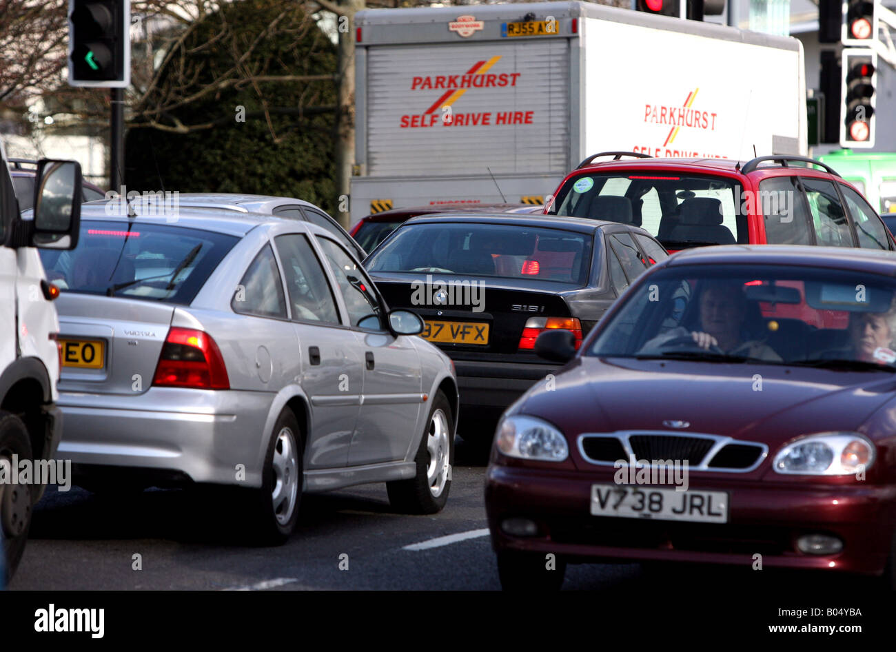 Cars waits wait in a traffic jam queue at traffic lights Stock Photo ...