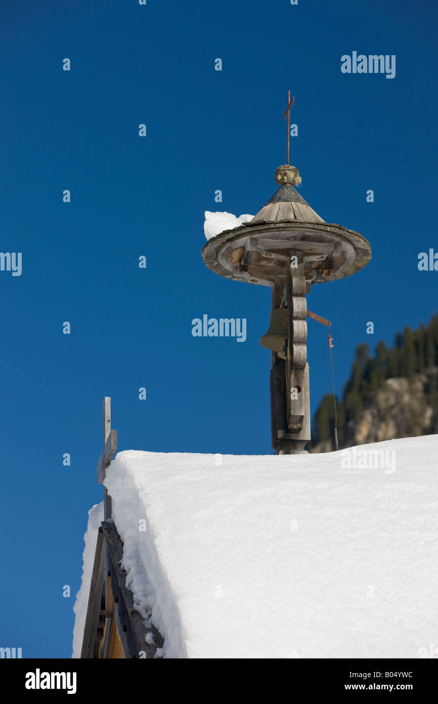 Small bell tower on the Kapelle Saint Leonhard (chapel) covered in snow ...