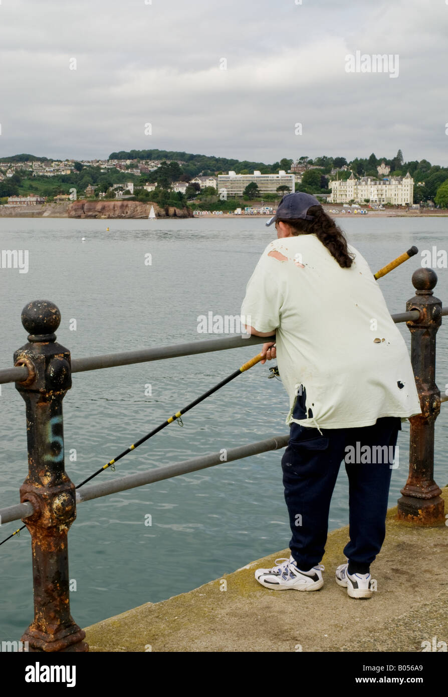 FISHING OFF TORQUAY PIER Stock Photo - Alamy