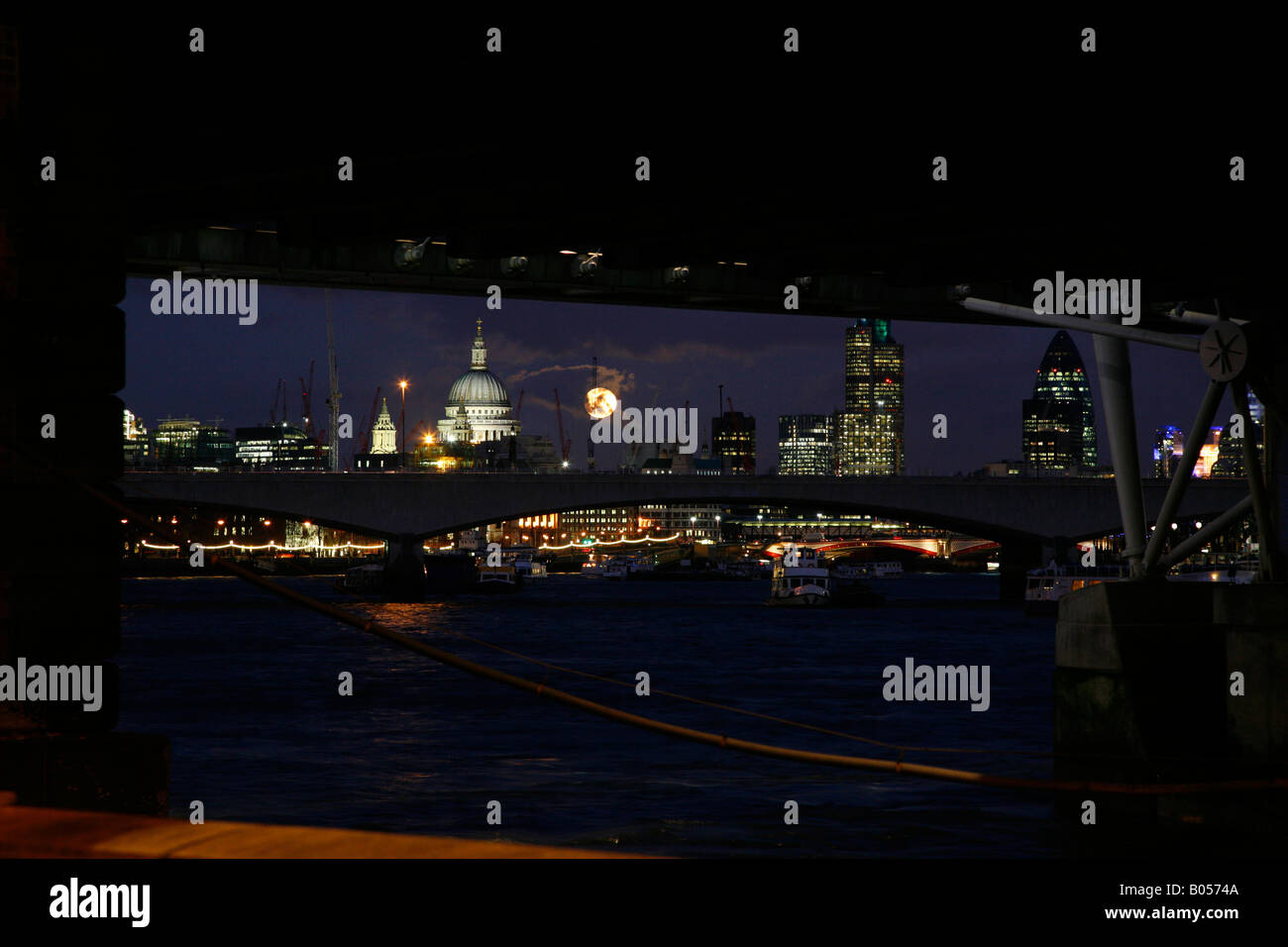 Full moon rising over the City of London Stock Photo - Alamy