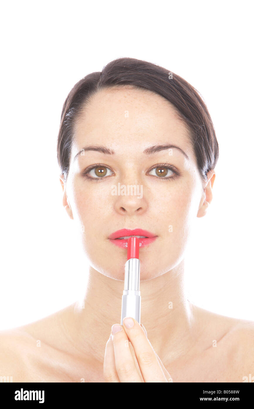 Young Woman Applying Red Lipstick Model Released Stock Photo - Alamy