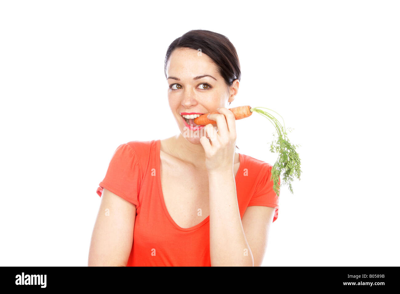 Young Woman Eating Carrot Model Released Stock Photo - Alamy