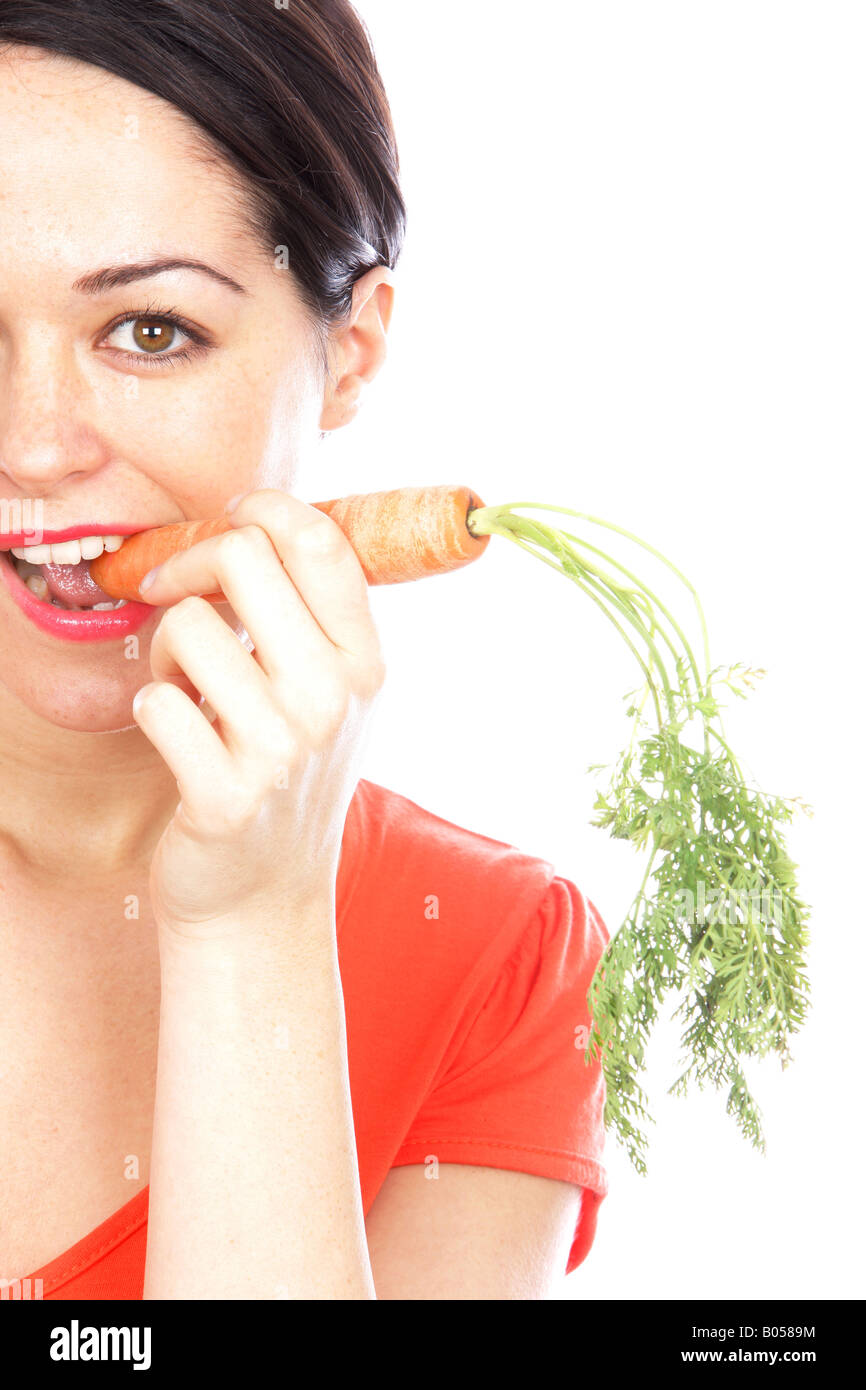 Young Woman Eating Carrot Model Released Stock Photo - Alamy