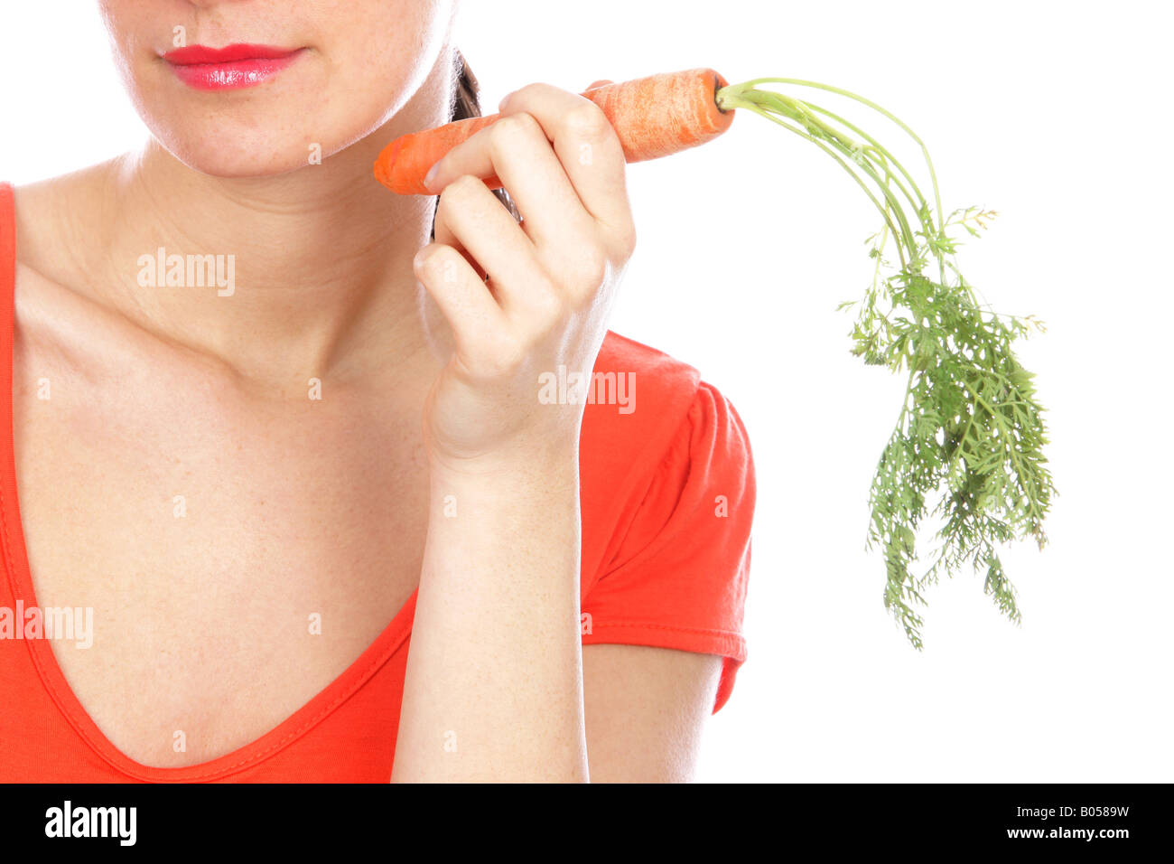 Young Woman Eating Carrot Model Released Stock Photo - Alamy