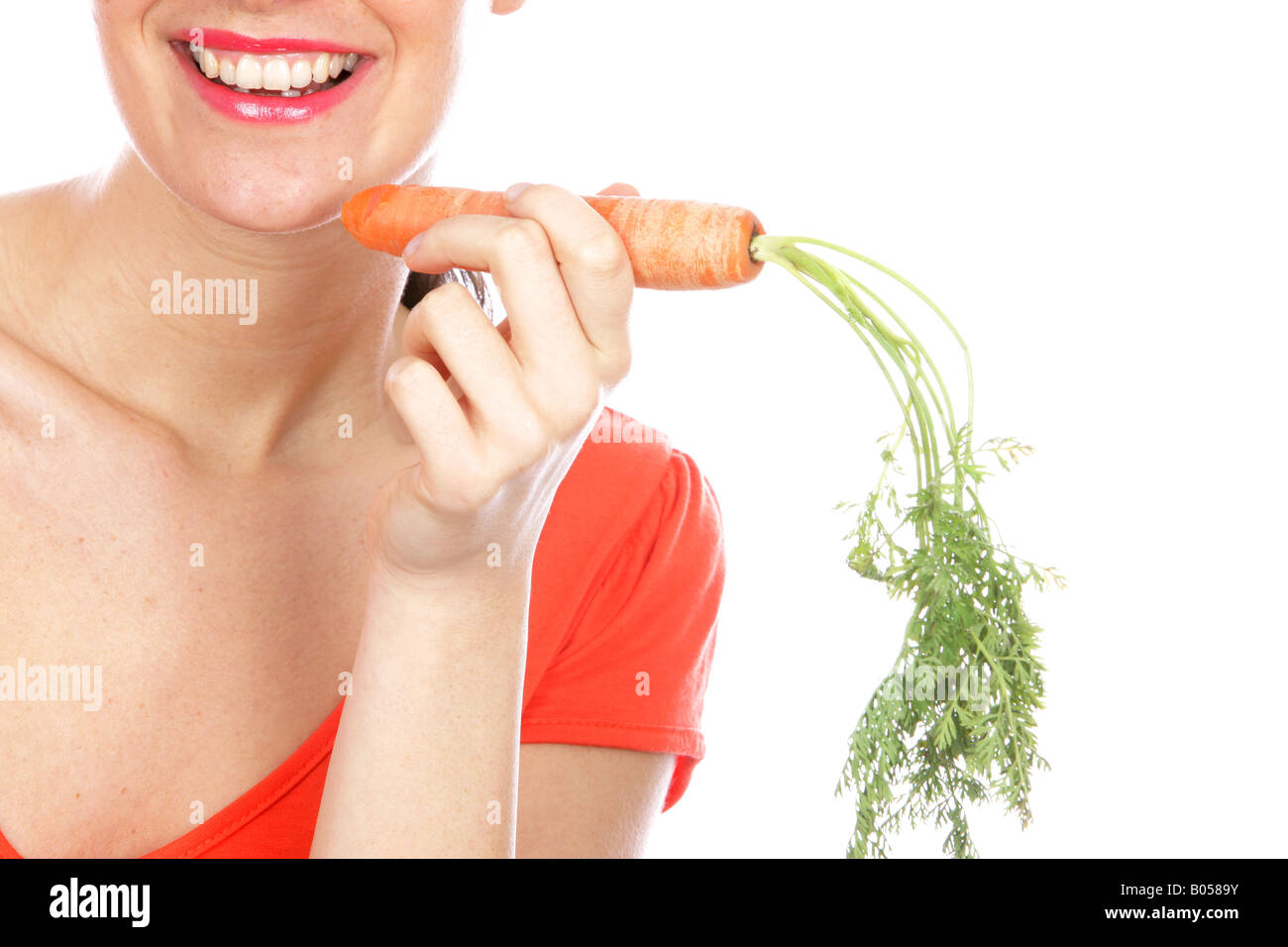 Young Woman Eating Carrot Model Released Stock Photo - Alamy