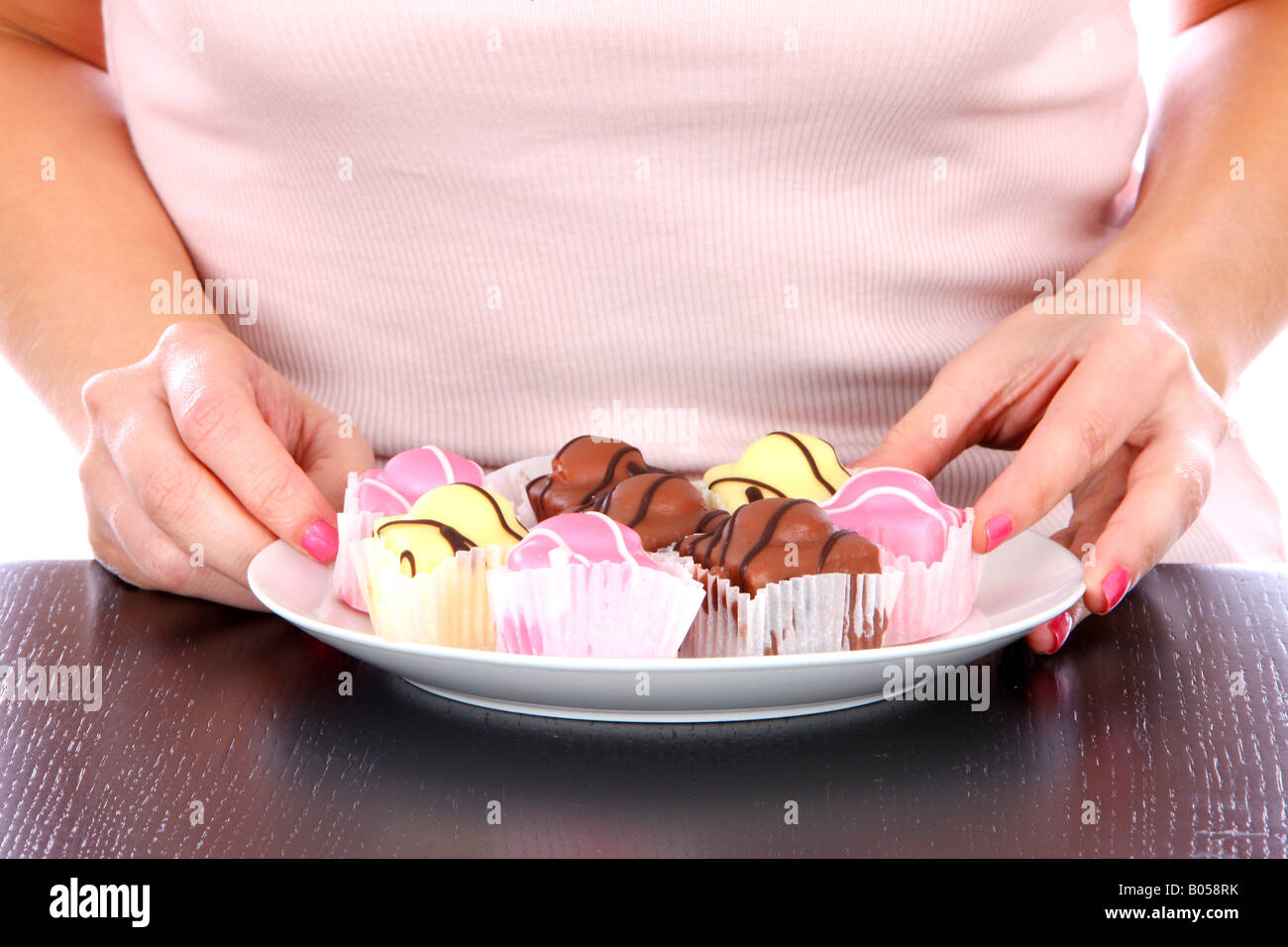 Young Woman Choosing a French Fancy Model Released Stock Photo - Alamy