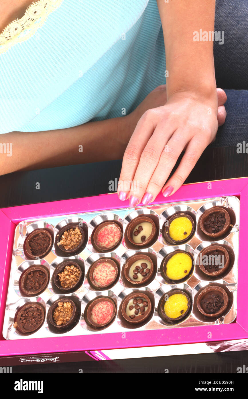 Young Woman Choosing Chocolates Model Released Stock Photo - Alamy