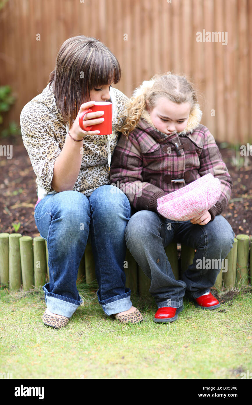 Sisters Talking Models Released Stock Photo - Alamy