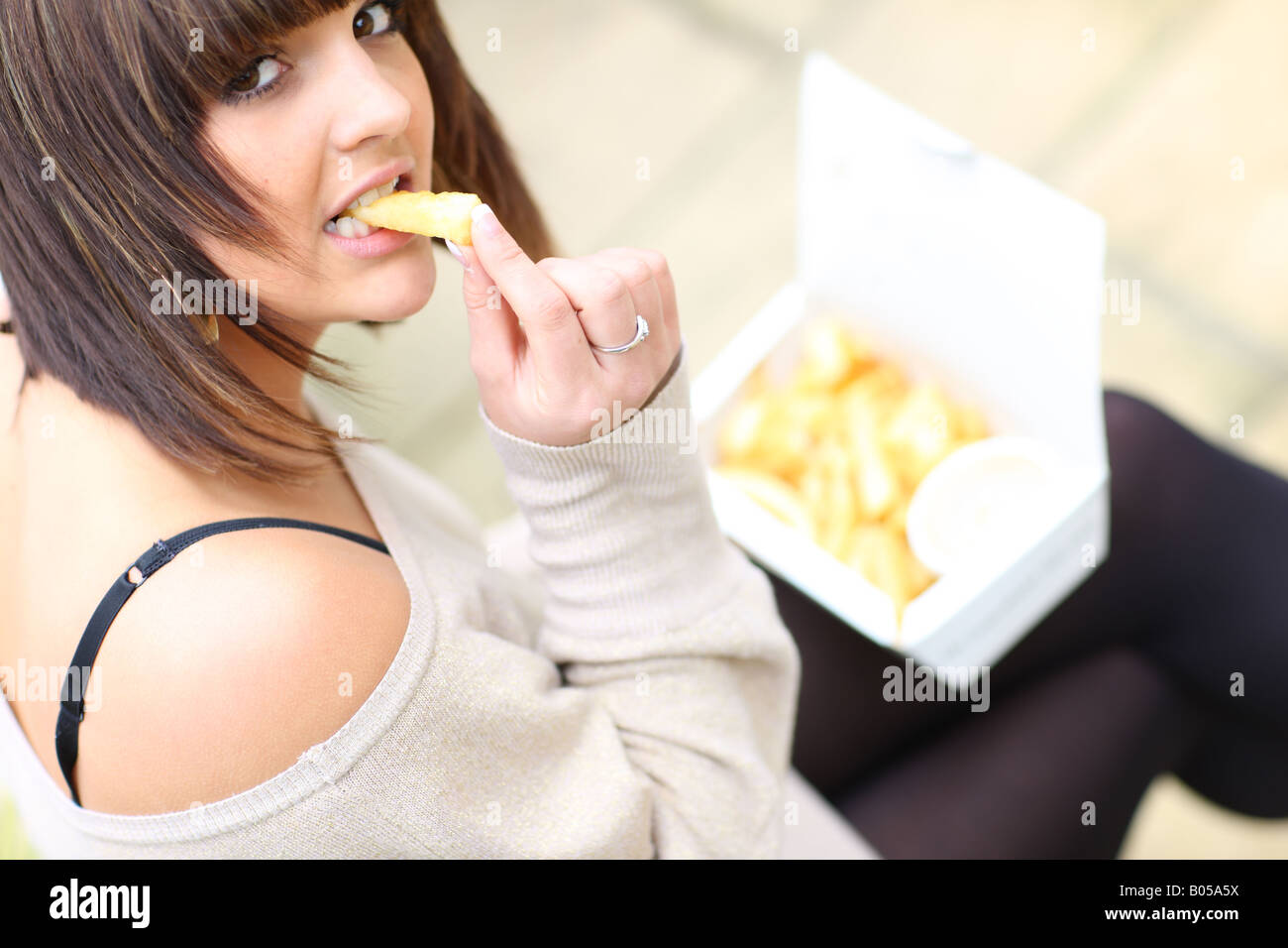 Teenage Girl Eating Chips Model Released Stock Photo - Alamy