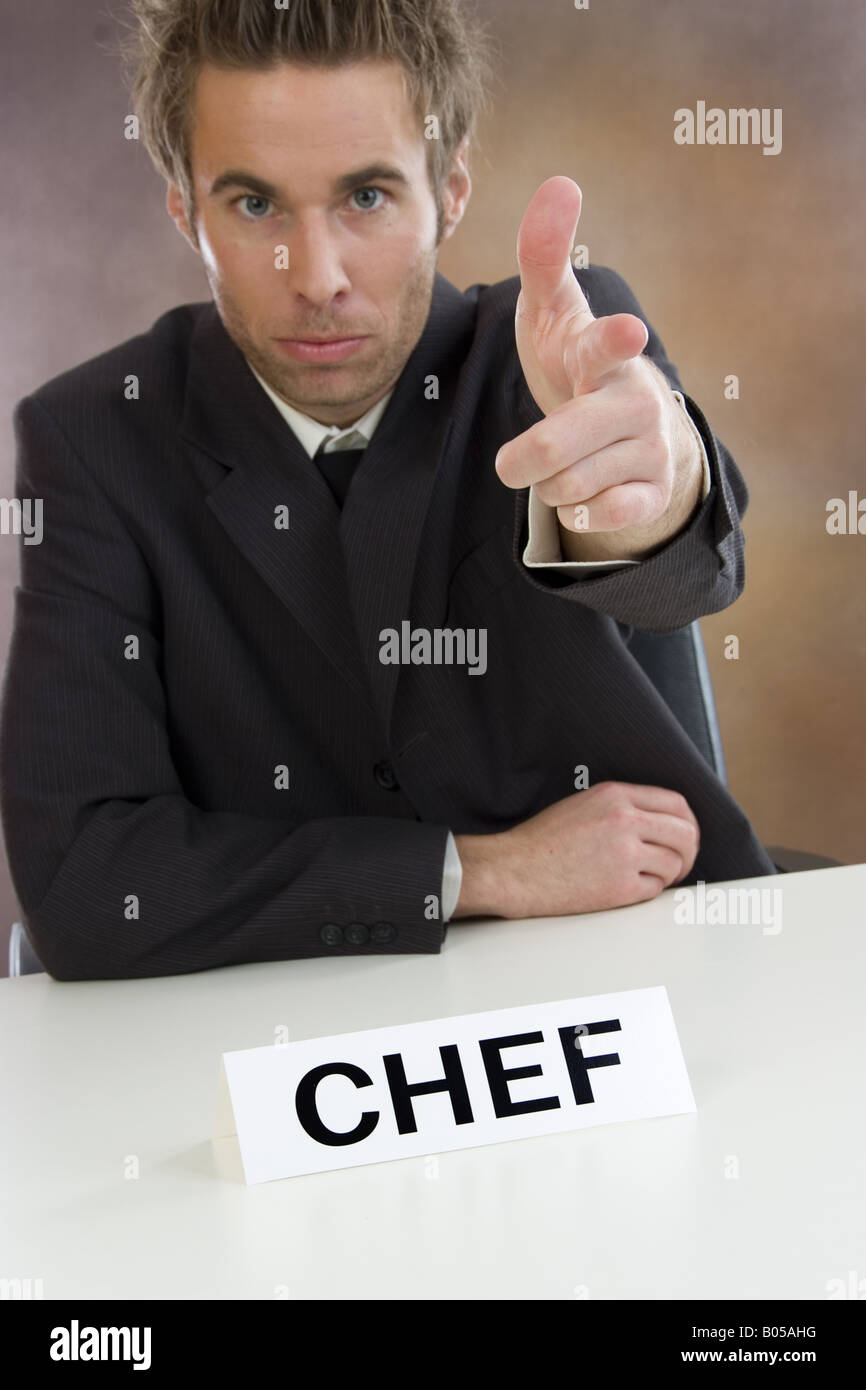 chief at desktop, taking aim at the camera Stock Photo - Alamy