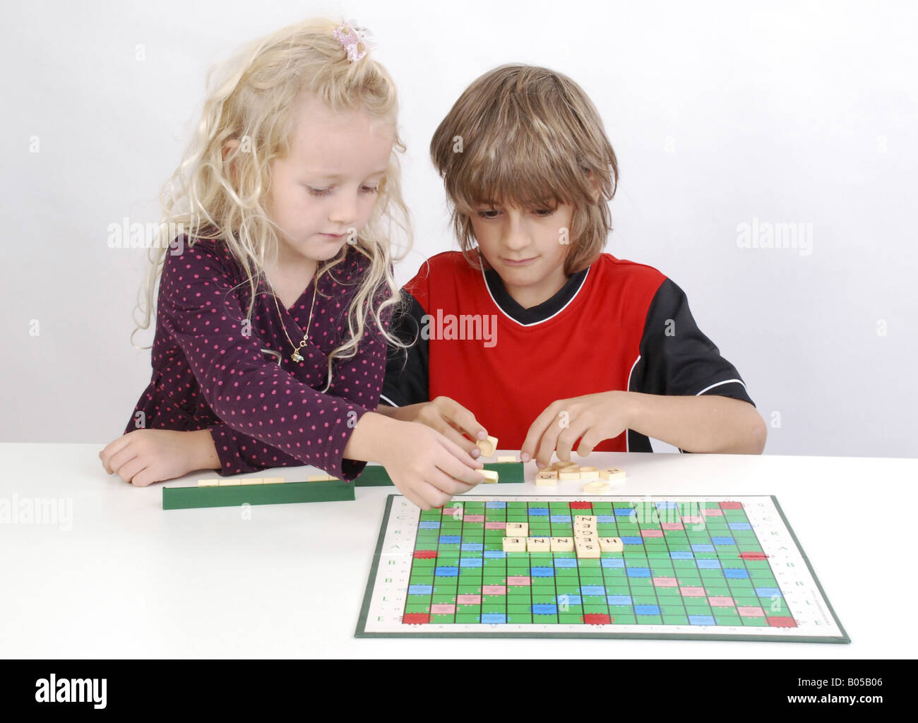 sister and brother playing together Scrabble Stock Photo - Alamy