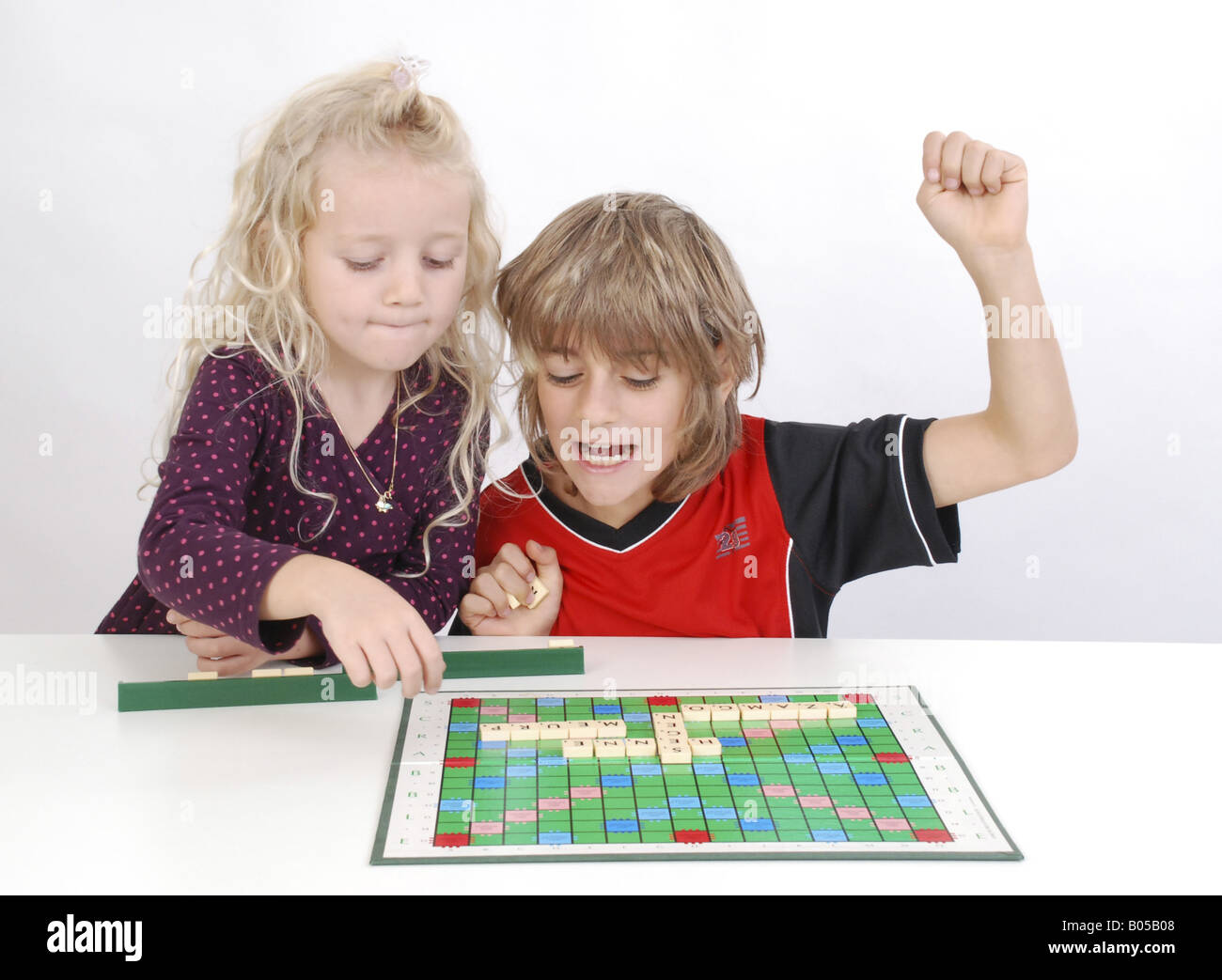 sister and brother playing together Scrabble Stock Photo - Alamy