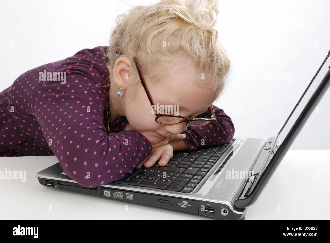 little girl sleeping on laptop Stock Photo - Alamy