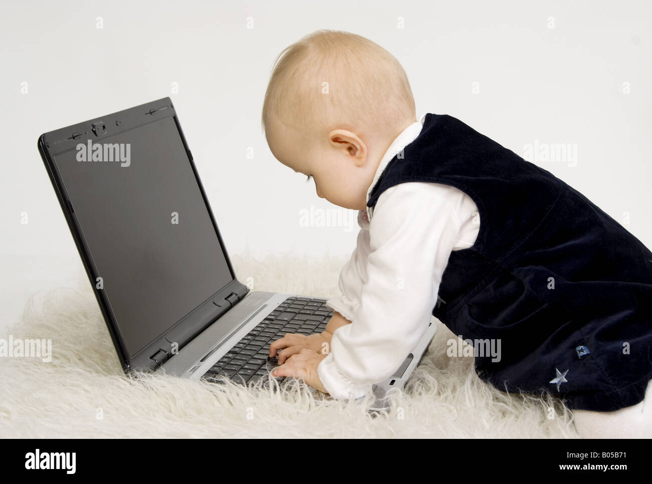little child using laptop Stock Photo - Alamy