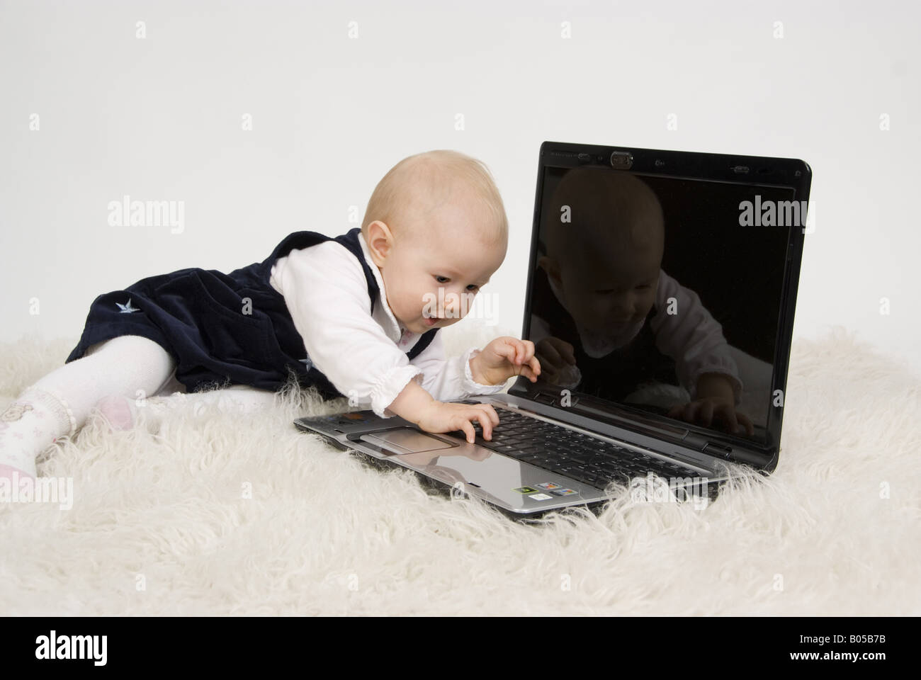 little child using laptop Stock Photo - Alamy