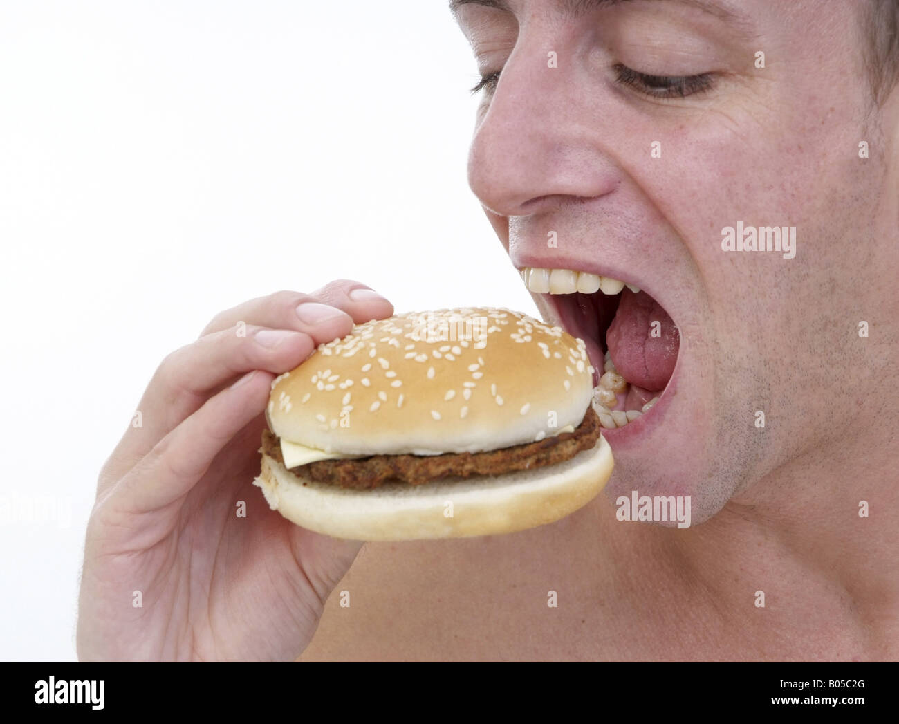 man eating hamburger Stock Photo - Alamy