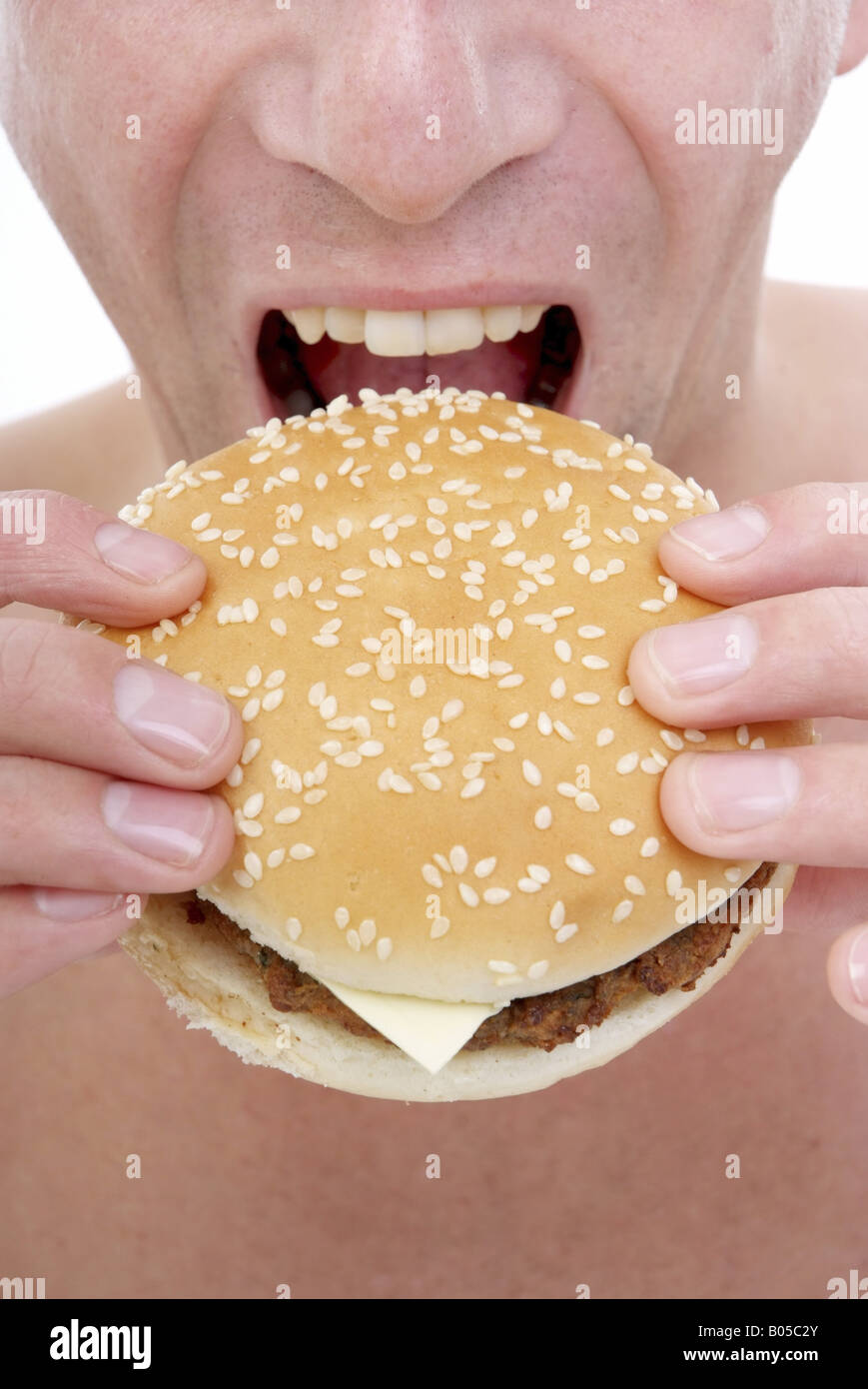 man eating hamburger Stock Photo - Alamy