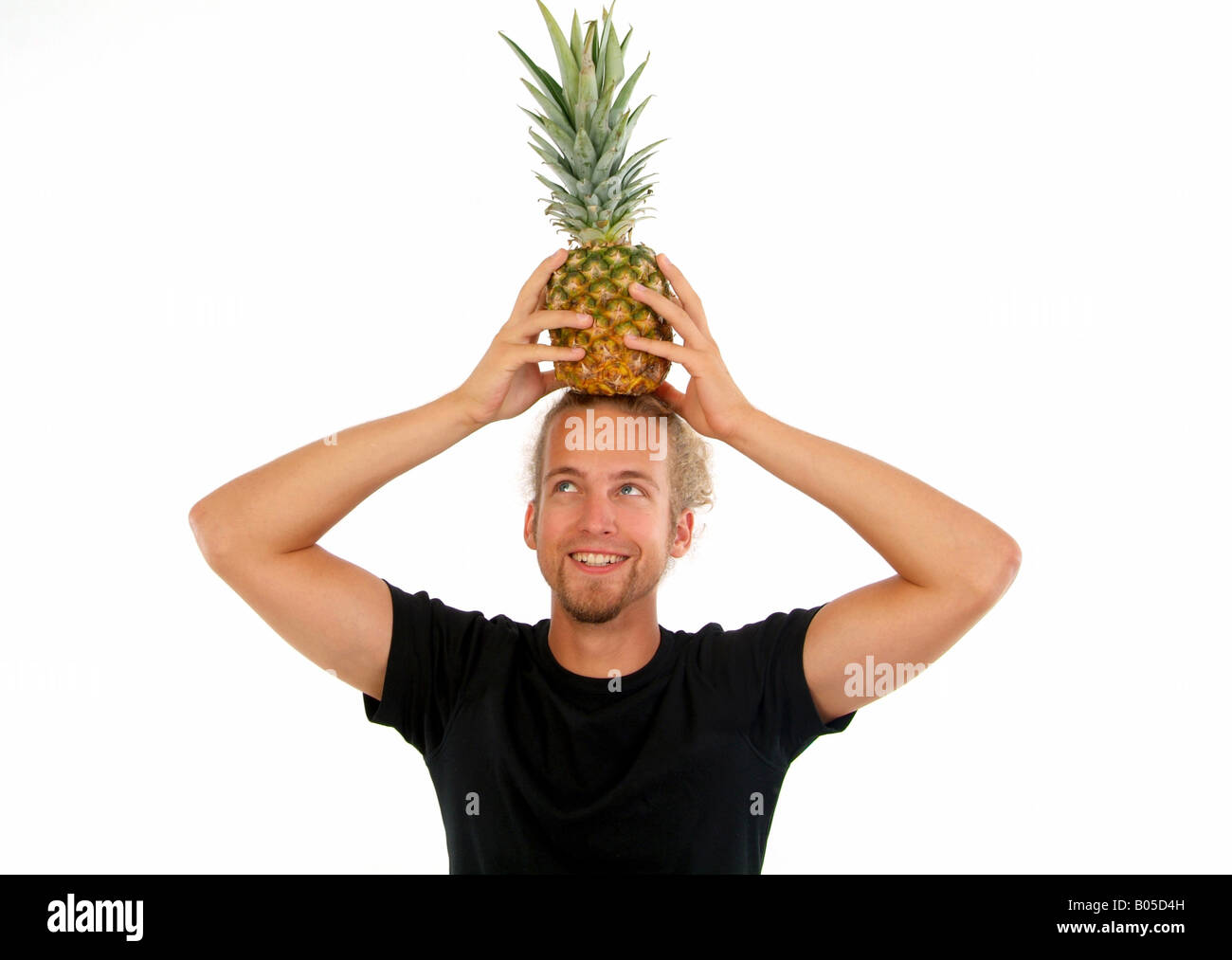 young man with pineapple on head Stock Photo - Alamy