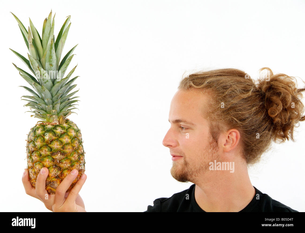 young man with pineapple Stock Photo - Alamy