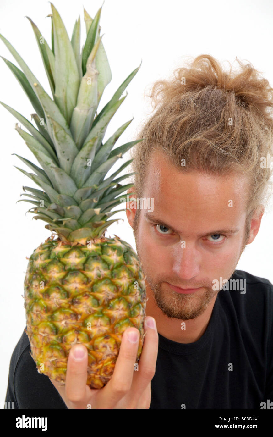 young man with pineapple Stock Photo - Alamy