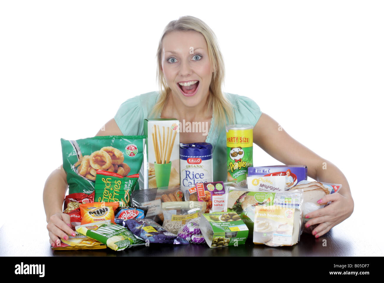 Woman With Snacks Stock Photo - Alamy