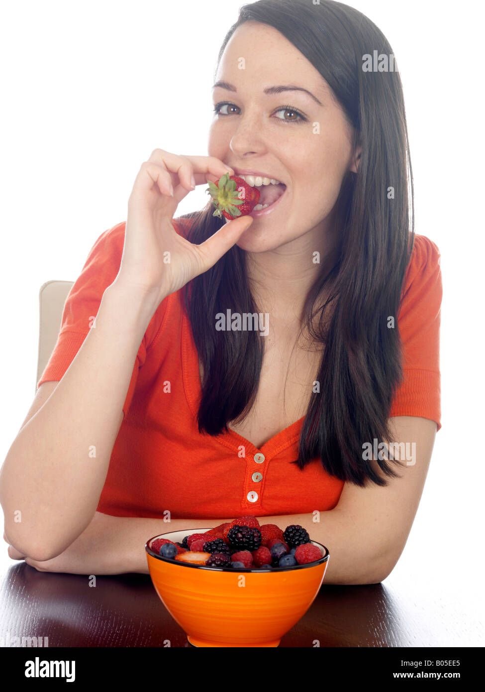 Young Woman Eating A Strawberry Model Released Stock Photo - Alamy