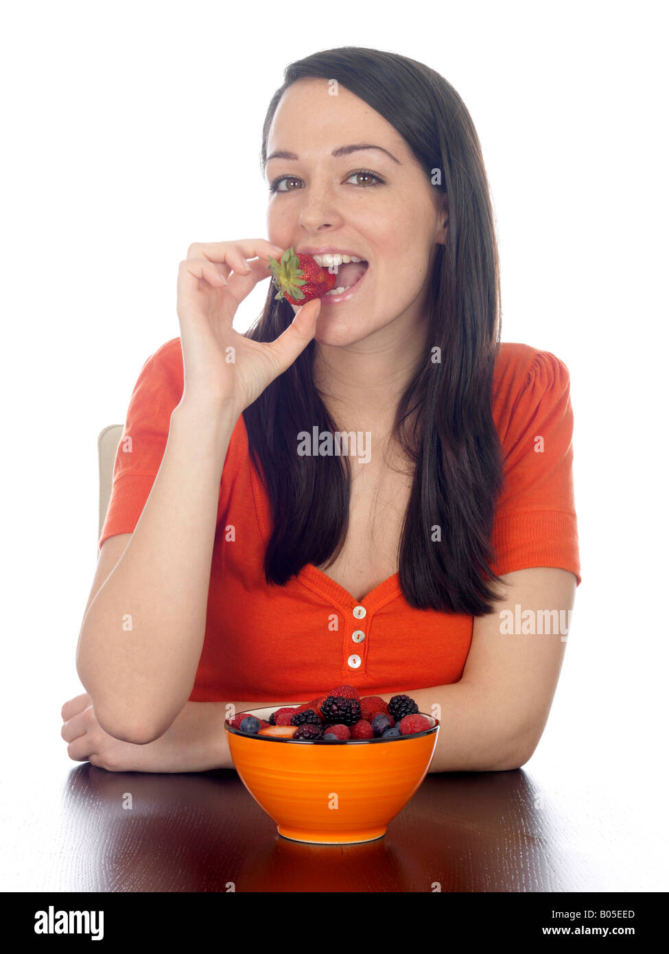 Young Woman Eating A Strawberry Model Released Stock Photo - Alamy