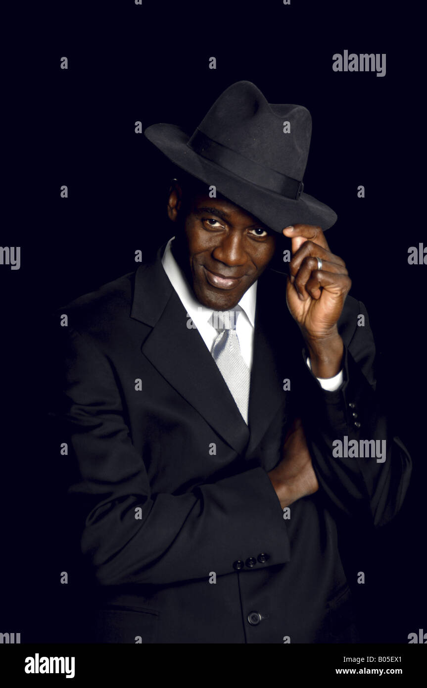 Handsome mid adult african american man in a fine black business suit ...