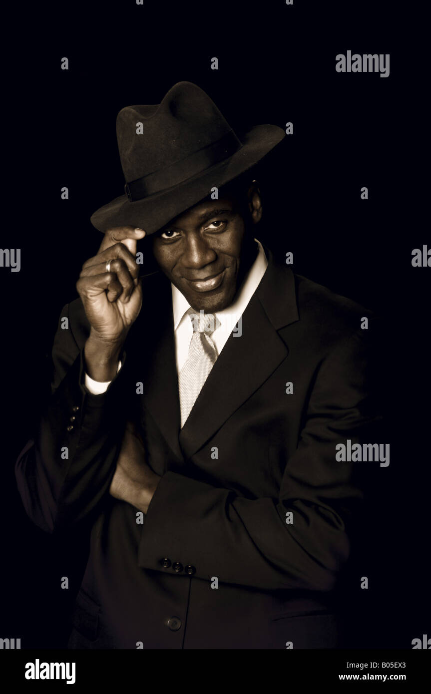 Handsome mid adult african american man in a fine black business suit ...