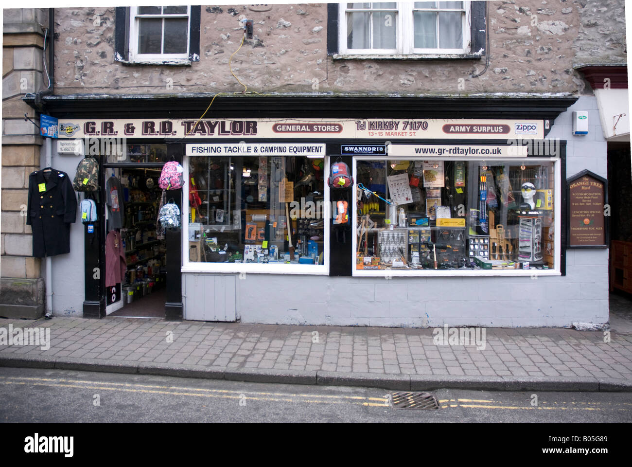 General ironmongery and clothing shop Stock Photo - Alamy