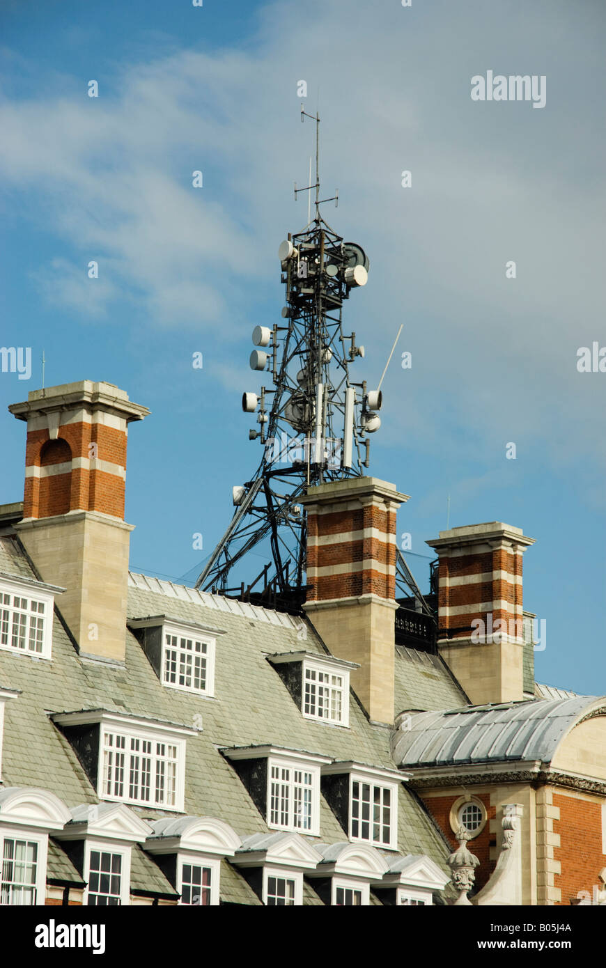 Telecoms radio mast on top of building Stock Photo - Alamy
