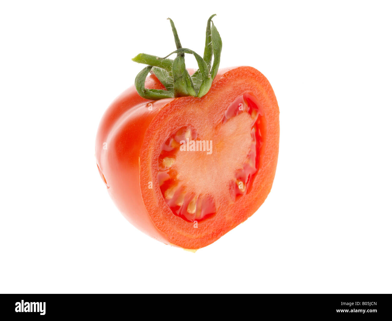 Halved tomato hi-res stock photography and images - Alamy