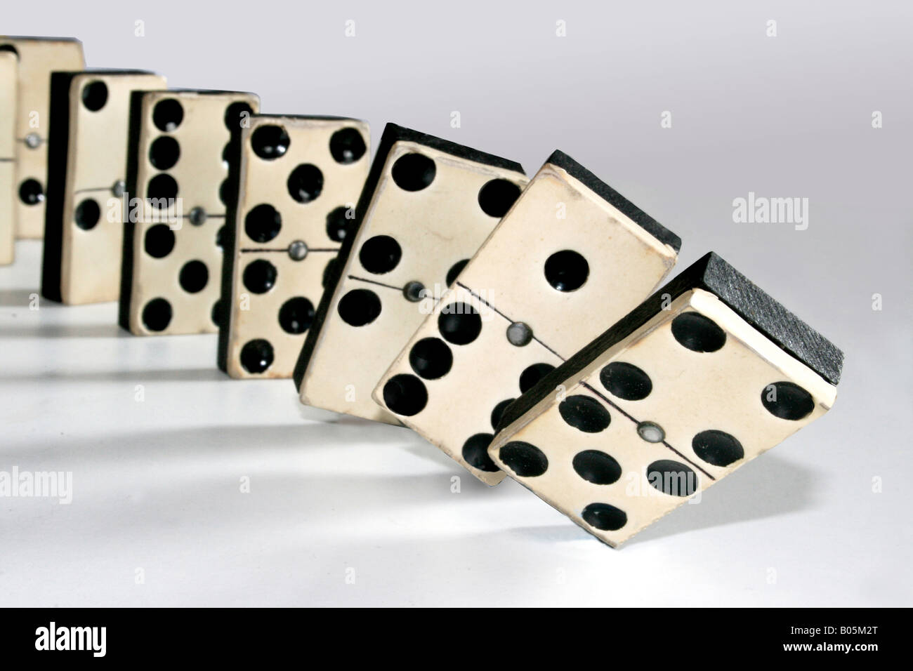 Dominoes falling hi-res stock photography and images - Alamy