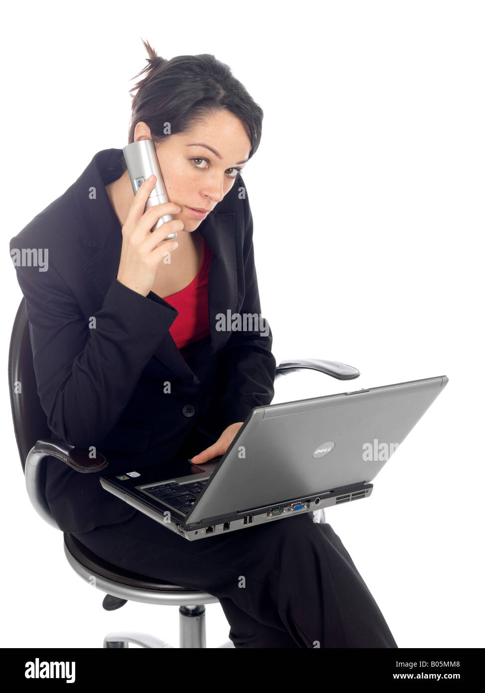 Young Woman Using Telephone and Laptop Model Released Stock Photo - Alamy