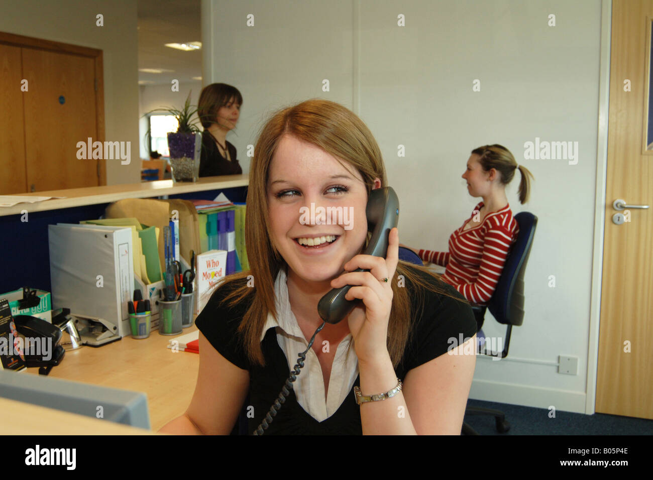 Receptionist works reception desk hi-res stock photography and images ...