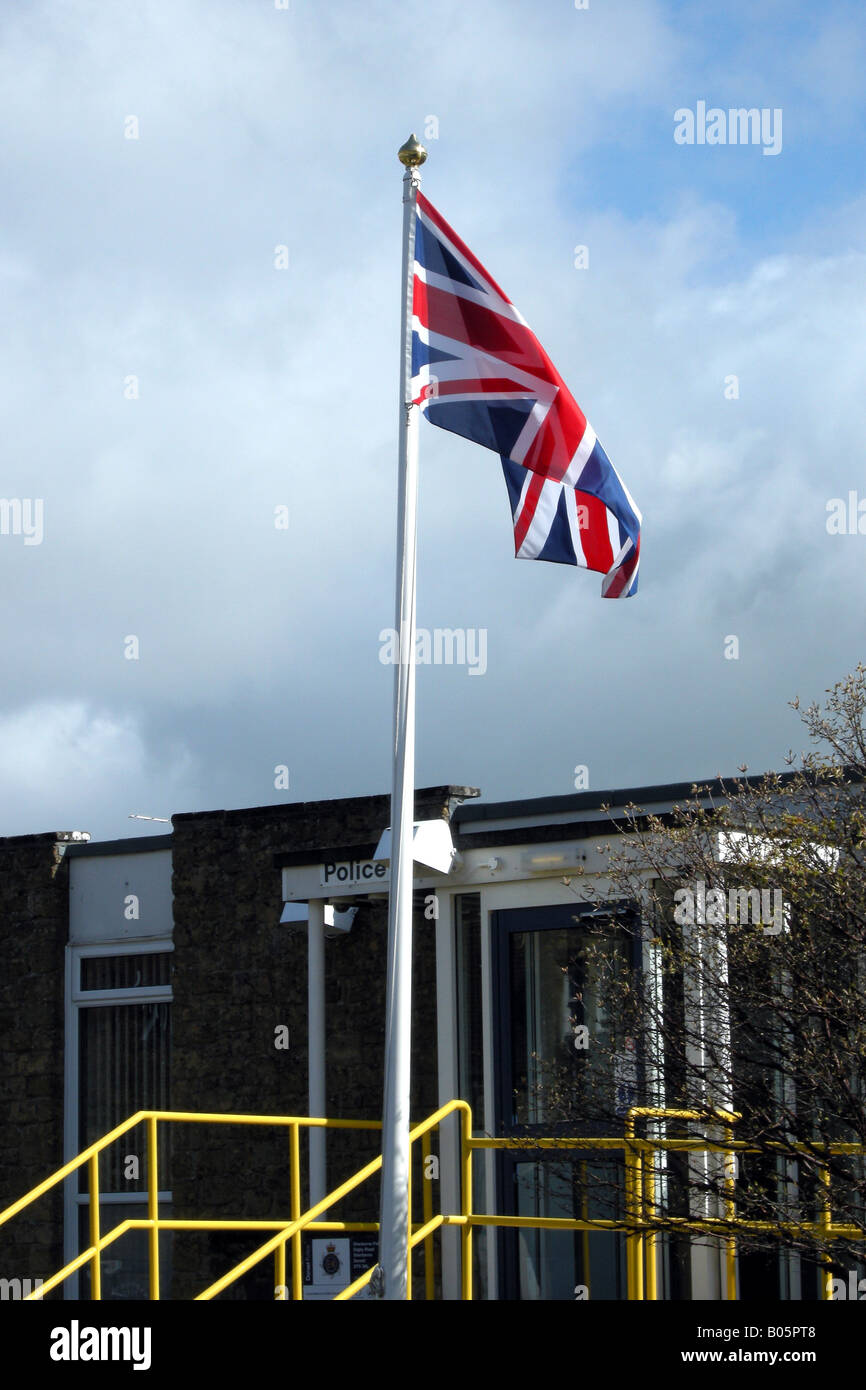 British Union Jack flag flying in the breeze outside a Police Station ...