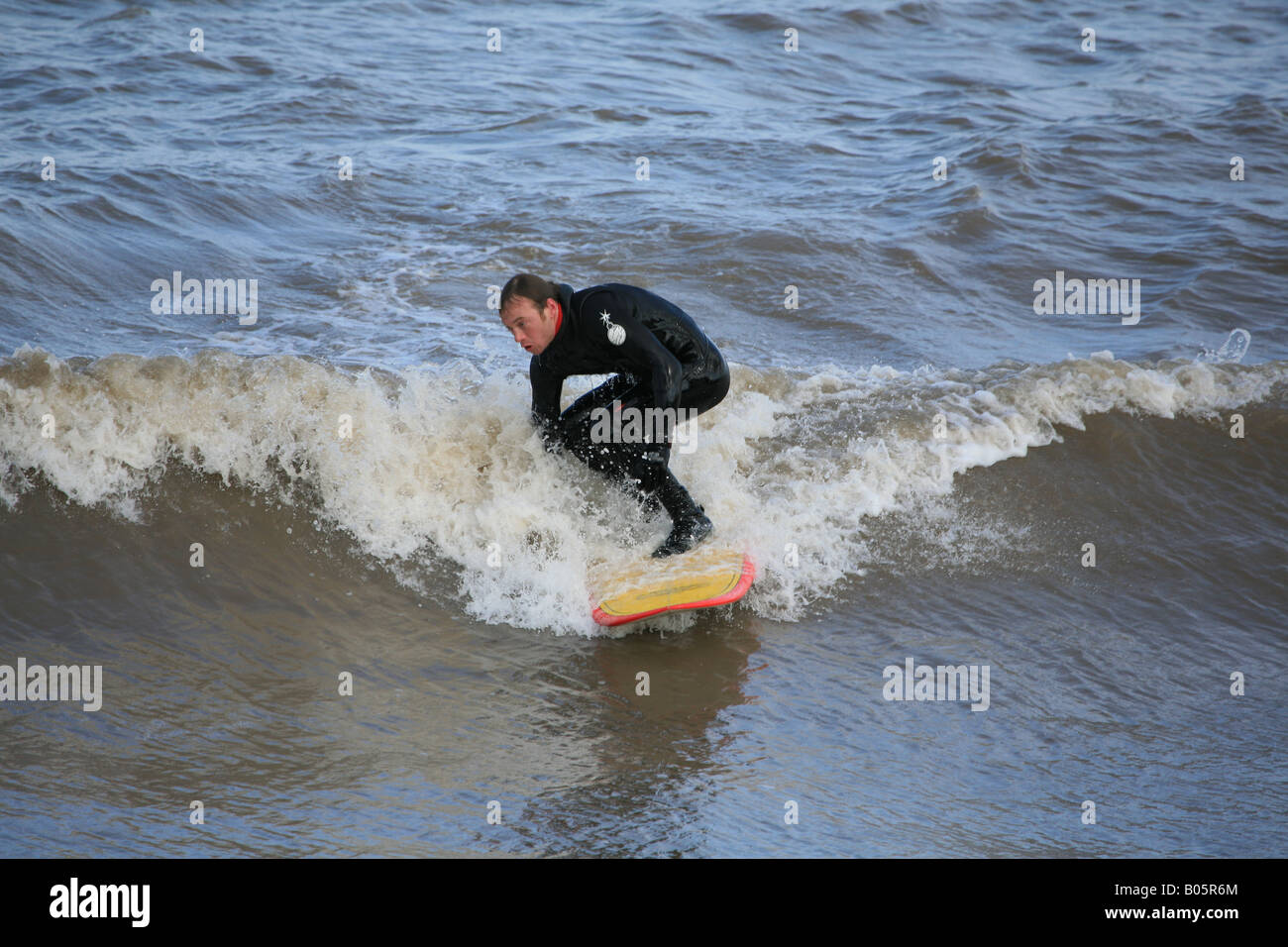 Curling into the Wave Stock Photo - Alamy