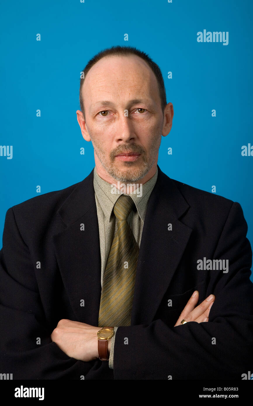 the portrait of senior man on blue background Stock Photo - Alamy