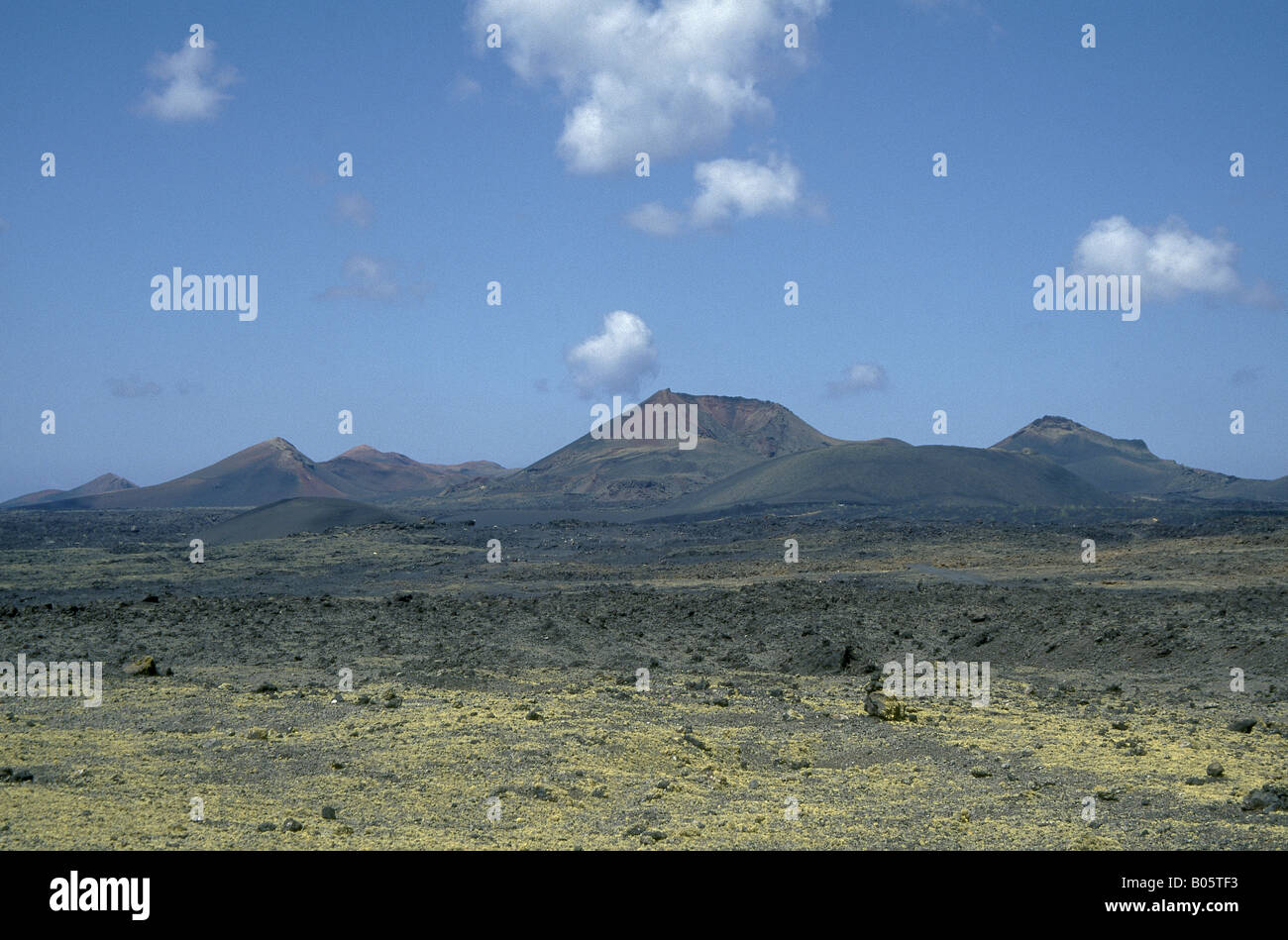 National park. Fire Mountains. Volcano. Half cone shaped peak. Black ...