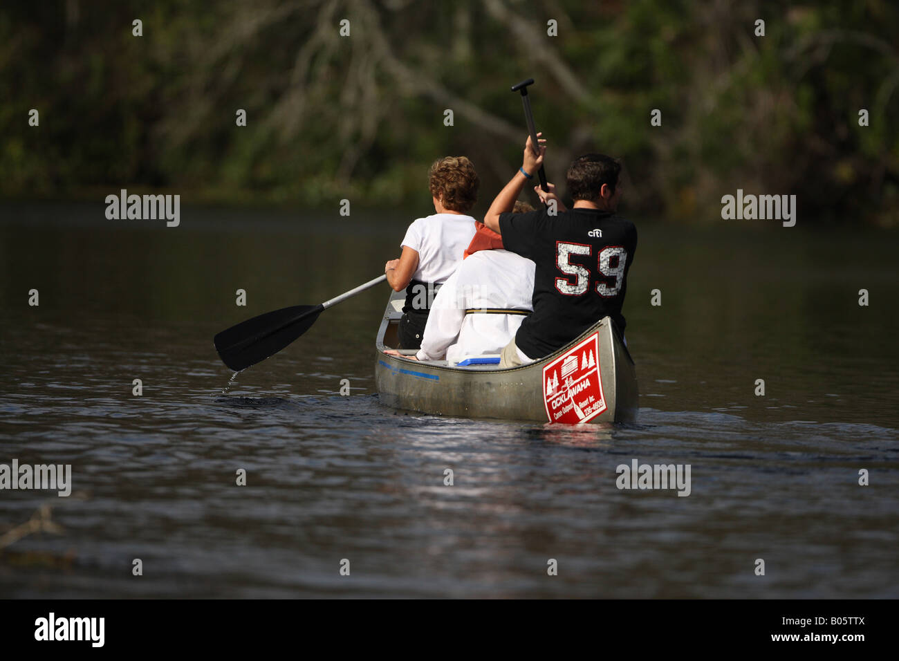 family canoeing down river in the middle of picture landscape Stock ...